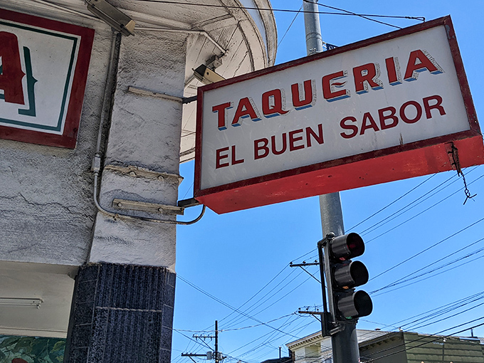 The iconic red "TACOS" sign beckons like a lighthouse for the hungry. No fancy frills needed when the food speaks this loudly.