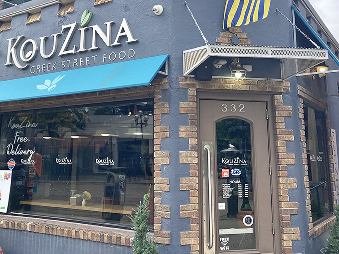 KouZina's distinctive blue awnings and brick-accented facade stand out on Royal Oak's Main Street like a Mediterranean beacon calling hungry travelers home.