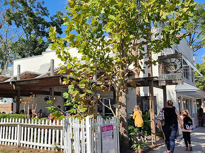 The charming white exterior of Timoti's, with its picket fence and leafy surroundings, looks like the seafood equivalent of grandma's house—if grandma were a world-class fishmonger.
