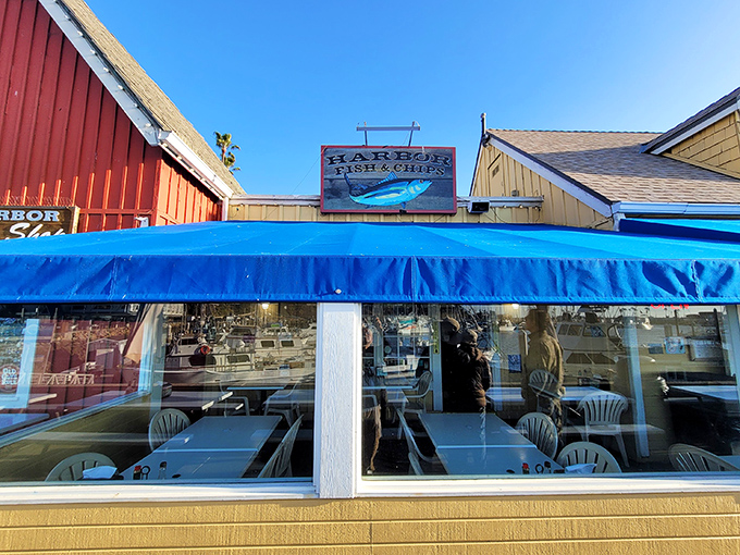 The unassuming exterior of Harbor Fish & Chips in Oceanside hides culinary treasures within. Like finding Shakespeare writing in a garden shed.