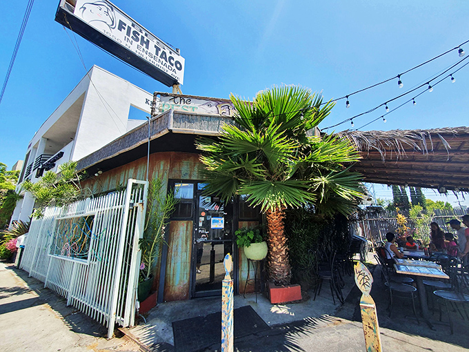 The weathered turquoise exterior isn't trying to impress anyone&mdash;it's saving all its energy for what happens inside those doors. Beach shack vibes in the heart of Los Feliz.