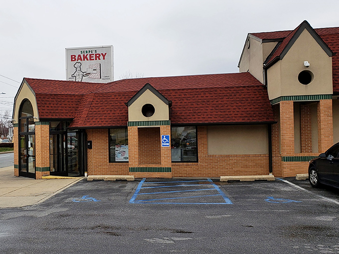 The iconic Serpe's Bakery exterior, with its distinctive red roof and Italian flag banner, stands as a Delaware landmark that's been satisfying sweet tooths for generations.