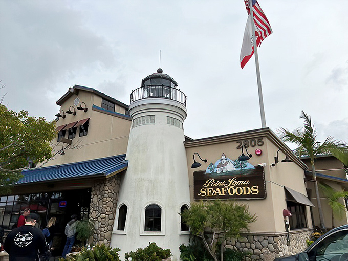 The iconic lighthouse-inspired architecture of Point Loma Seafoods stands as a beacon for seafood lovers, promising maritime delights under the perfect San Diego sky.