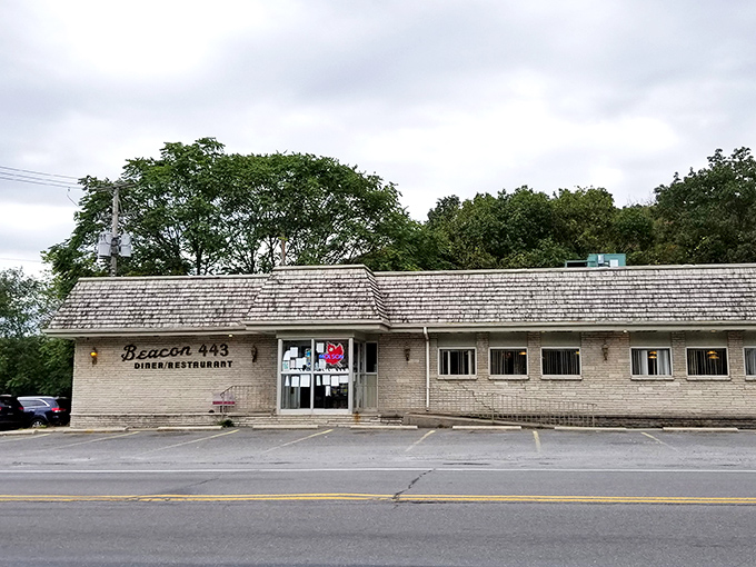 The weathered sign stands like a sentinel of satisfaction, promising "Family Dining" that delivers on comfort and nostalgia with every visit.