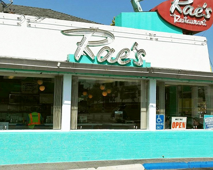 That iconic turquoise exterior isn't just a color choice&mdash;it's a time machine disguised as a diner. Welcome to Rae's, where nostalgia comes served with every meal.