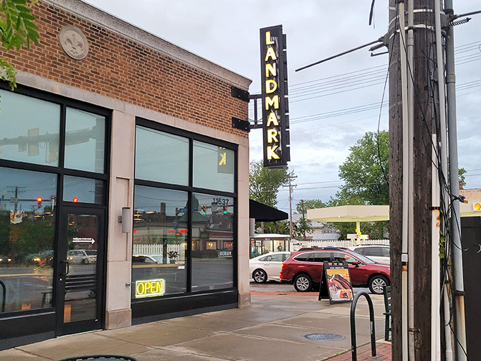 That vintage "LANDMARK" sign beckoning from the street corner promises serious barbecue business awaits inside.