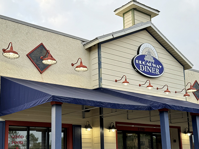 The classic blue awning and charming facade of Broadway Diner in Bartow stands as a beacon for breakfast lovers seeking comfort food perfection.