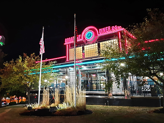 The Broadway Diner glows like a neon dream against the night sky, a beacon of comfort food that's been saving hungry Baltimoreans from themselves for generations.
