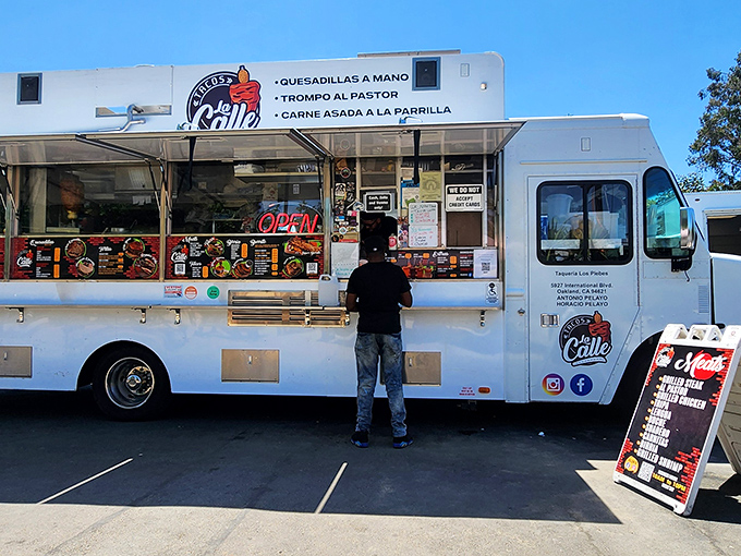 The gleaming white chariot of flavor that's worth the pilgrimage. Tacos La Calle's truck stands ready to transform your understanding of street food.