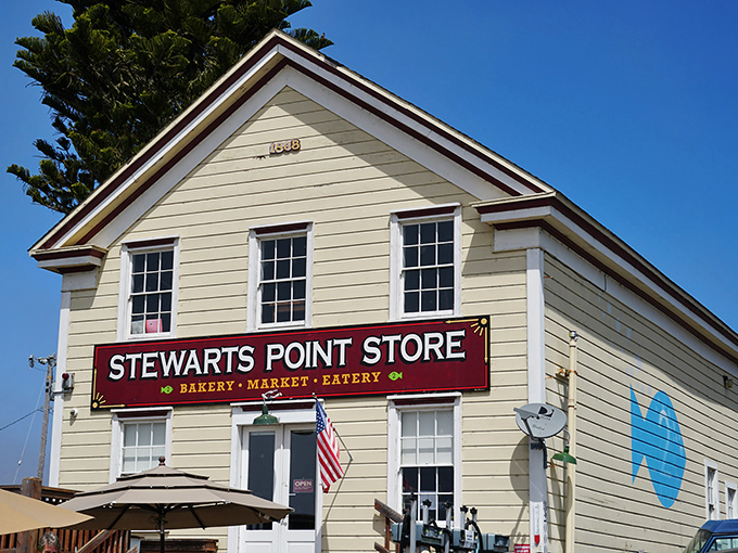 The iconic Stewarts Point Store stands proudly against the California sky, its weathered wooden steps promising culinary treasures within. A coastal landmark worth the winding drive.