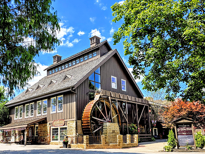 The historic Ye Olde Mill stands proudly against an Ohio blue sky, its wooden water wheel ready to churn&mdash;much like they've been churning ice cream since 1914. 