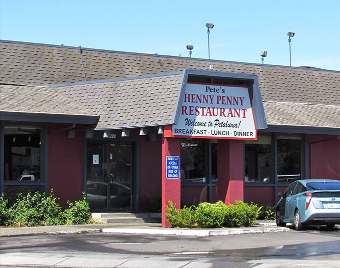 The bright red exterior of Pete's Henny Penny stands like a beacon of breakfast hope, promising comfort food that doesn't need fancy frills to be extraordinary.