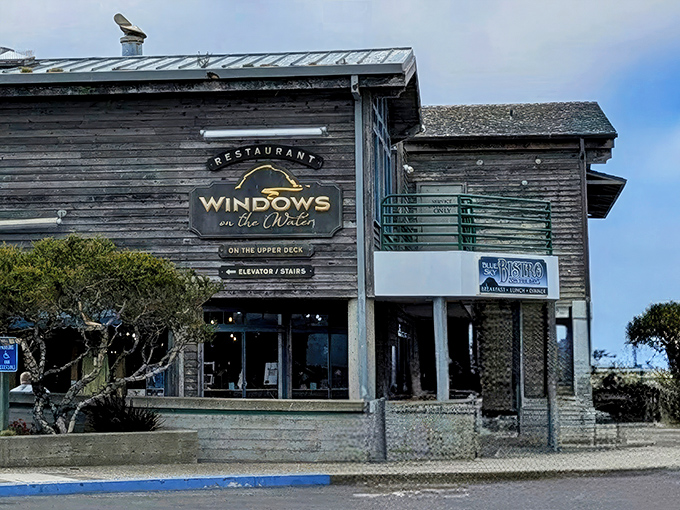 The weathered wooden exterior of Windows on the Water stands like a sentry guarding culinary treasures, its sign promising both views and victuals worth the journey.