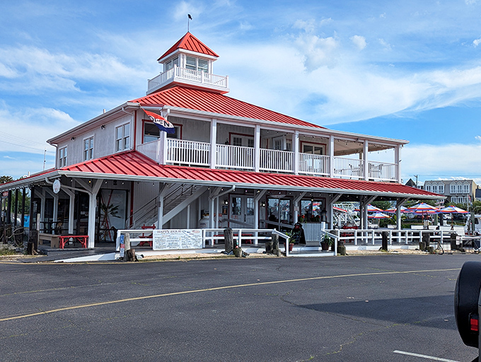 That iconic red roof against the Delaware sky isn't just eye-catching—it's a beacon for seafood lovers signaling the promise of ocean-fresh delights ahead.
