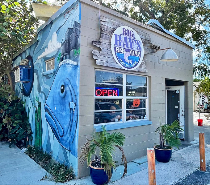 The unassuming exterior of Big Ray's Fish Camp proves once again that Florida's best seafood treasures often come in small packages. That fish mural isn't just decoration&mdash;it's a promise.
