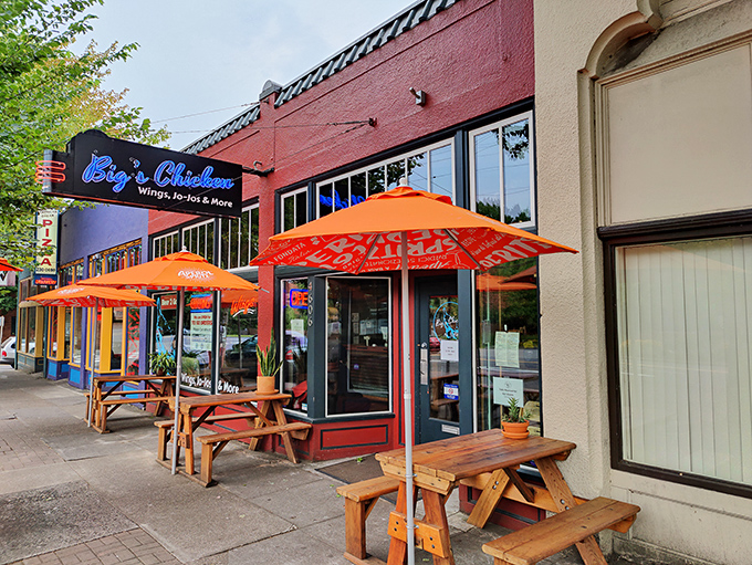 The bright red exterior of Big's Chicken welcomes hungry visitors with wooden picnic tables and cheerful orange umbrellas&mdash;Portland's version of a Southern front porch.