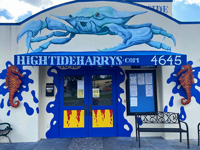 The giant blue crab guarding High Tide Harry's entrance isn't just decoration—it's a promise of the oceanic treasures waiting inside.