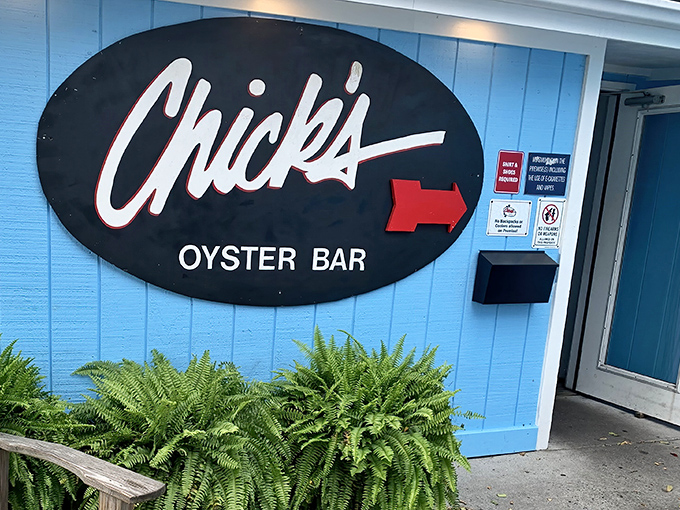 The iconic blue exterior with its simple oval sign promises no pretension&mdash;just seriously good seafood waiting inside. Virginia Beach's worst-kept secret beckons.