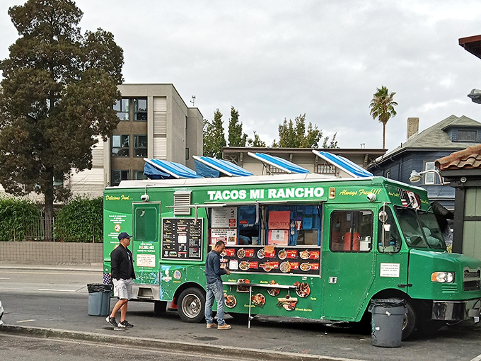 The emerald-green chariot of culinary dreams sits ready for action. Tacos Mi Rancho's vibrant food truck promises Mexican delights that'll make your taste buds stand at attention.