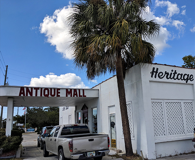 The classic white facade with that bold "ANTIQUE MALL" signage is like Florida's version of the pearly gates for treasure hunters.