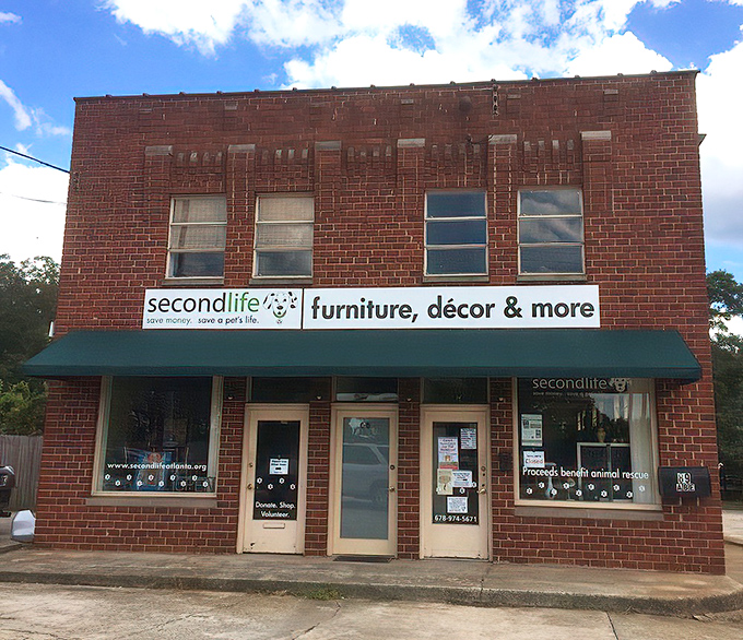 The unassuming brick exterior of Second Life Upscale Resale hides a treasure trove within. Like a speakeasy for bargain hunters, the modest storefront is just the beginning.