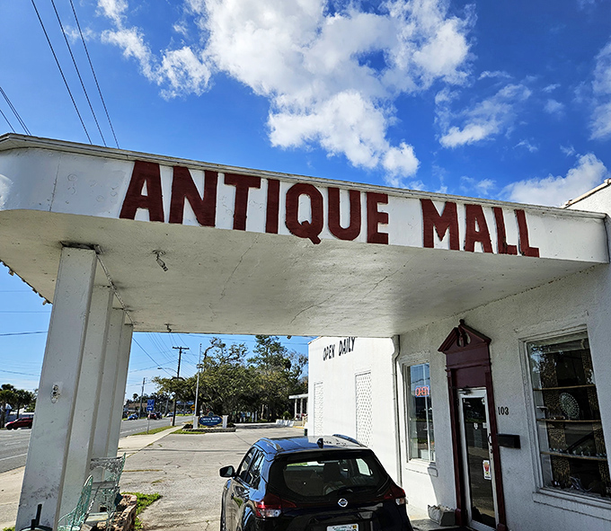 The classic white facade with that bold "ANTIQUE MALL" signage is like Florida's version of the pearly gates for treasure hunters.