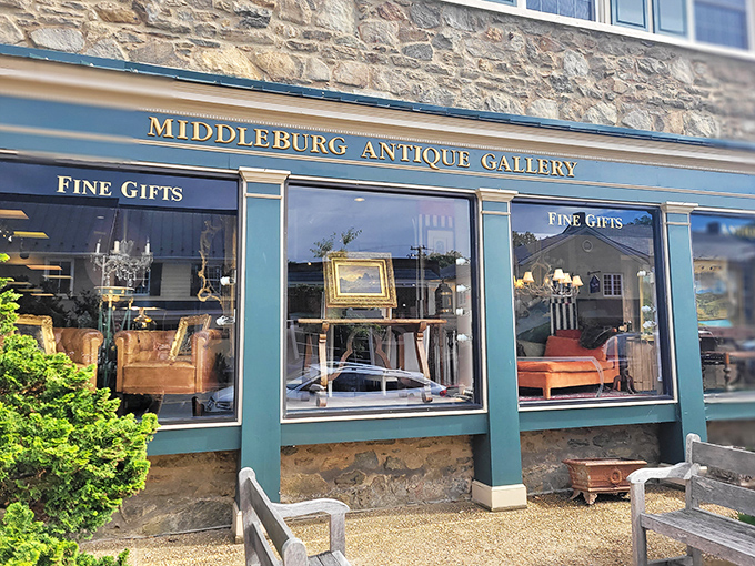 The stone facade of Middleburg Antique Emporium stands like a time portal in Virginia horse country, promising treasures behind those gleaming green-trimmed windows.