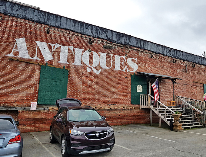 The brick facade with its bold "ANTIQUES" lettering isn't just advertising&mdash;it's a siren call to treasure hunters and nostalgia seekers alike.