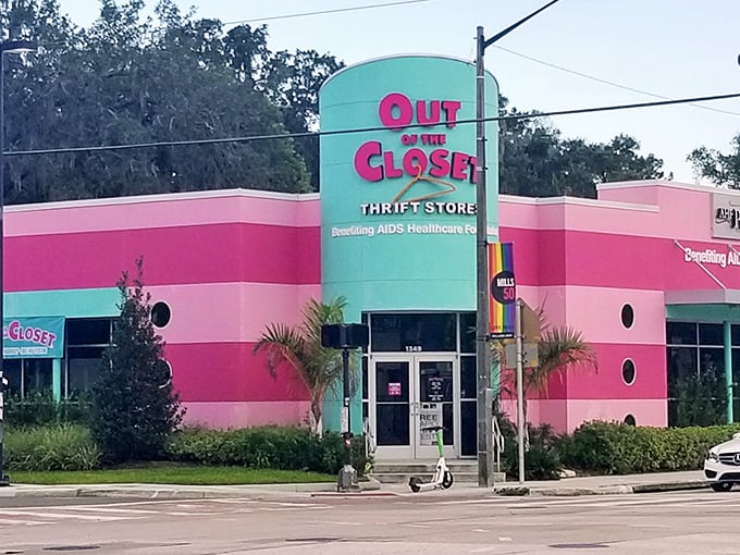 The unmistakable pink and turquoise facade of Out of the Closet stands out like a flamingo in a penguin convention, beckoning bargain hunters with its vibrant charm.