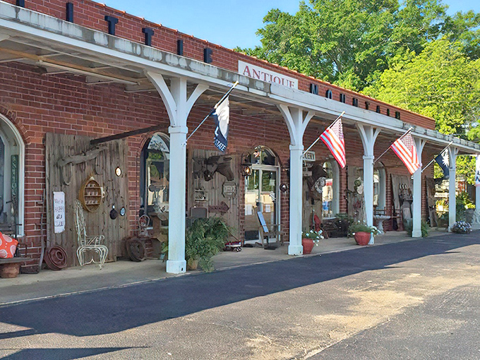 The charming brick exterior with white columns isn't just inviting&mdash;it's practically winking at you to come discover what treasures await inside.