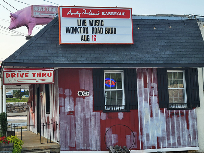 The giant pink pig on the roof isn't just decoration &ndash; it's a beacon of barbecue hope guiding hungry travelers to this rustic red barn-like paradise.