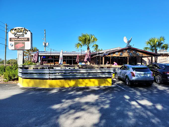 The classic roadhouse exterior beckons with its vintage sign and sunny yellow patio wall&mdash;Florida's answer to "come as you are, leave happier than you arrived."