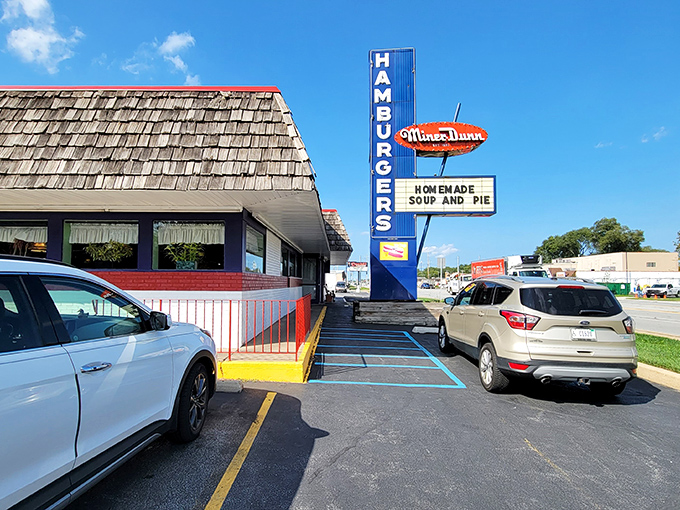 That iconic A-frame roof and vintage neon sign aren't just restaurant architecture&mdash;they're a time portal to when burgers were simple and simply perfect.
