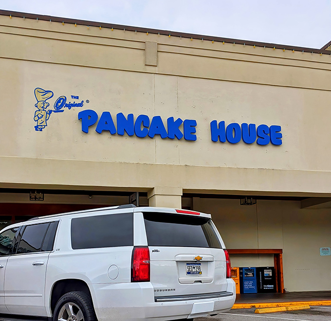 The blue sign beckons like a breakfast lighthouse in a sea of parking spaces. Columbia's morning treasure awaits!