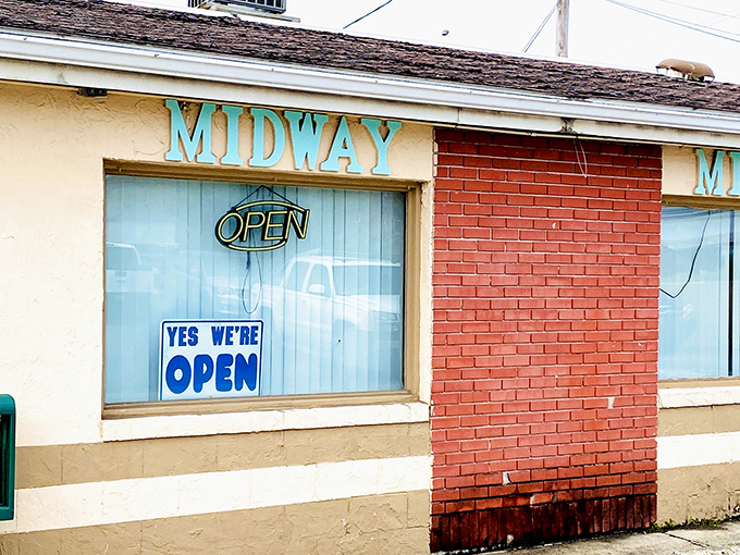 The unassuming beige exterior of Midway Restaurant stands as a beacon of breakfast hope in Kenton, where culinary magic happens without fanfare.