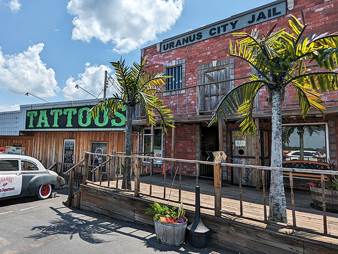 The Wild West meets roadside kitsch at Uranus City Jail, where palm trees and wooden boardwalks create an unexpected Missouri frontier experience.