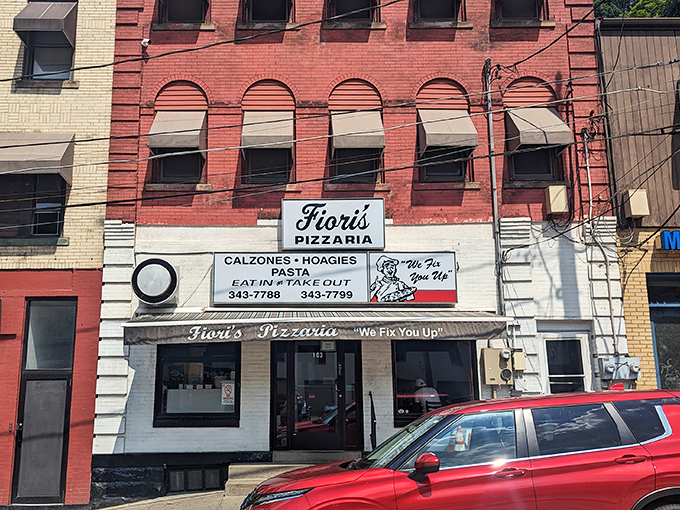 The unassuming brick facade of Fiori's Pizzaria stands like a culinary lighthouse on Brookline Boulevard, promising delicious salvation to hungry Pittsburghers.