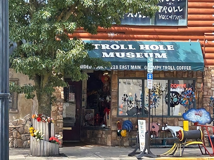 The unassuming storefront of Troll Hole Museum beckons with its cheery awning and colorful flowers, like a fairytale cottage hiding in plain sight on Main Street.
