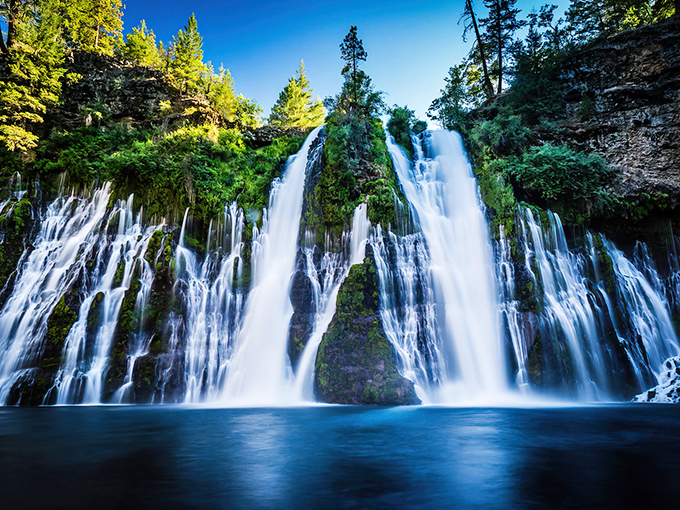 Nature's masterpiece in full display &ndash; Burney Falls cascades 129 feet in a hypnotic ballet of water and light that makes Niagara text you, "We need to talk."