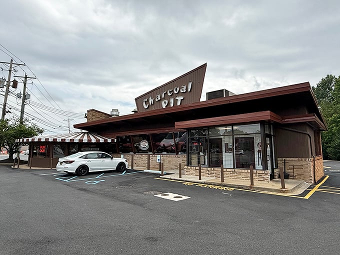The angular roof of Charcoal Pit rises from Concord Pike like a mid-century beacon, promising comfort food salvation to hungry Delawareans since the Eisenhower era.