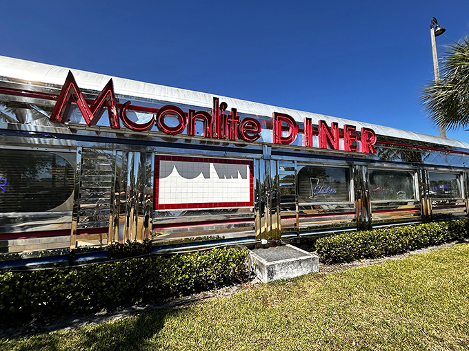 Chrome gleaming in the Florida sunshine, Moonlite Diner's exterior promises a time-traveling feast. This isn't just a restaurant&mdash;it's a shiny portal to simpler times. 