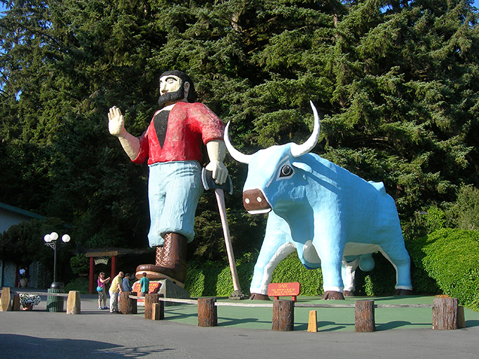 Paul and Babe stand sentinel against a backdrop of towering redwoods, like folklore giants who decided California's weather was better than Minnesota's.