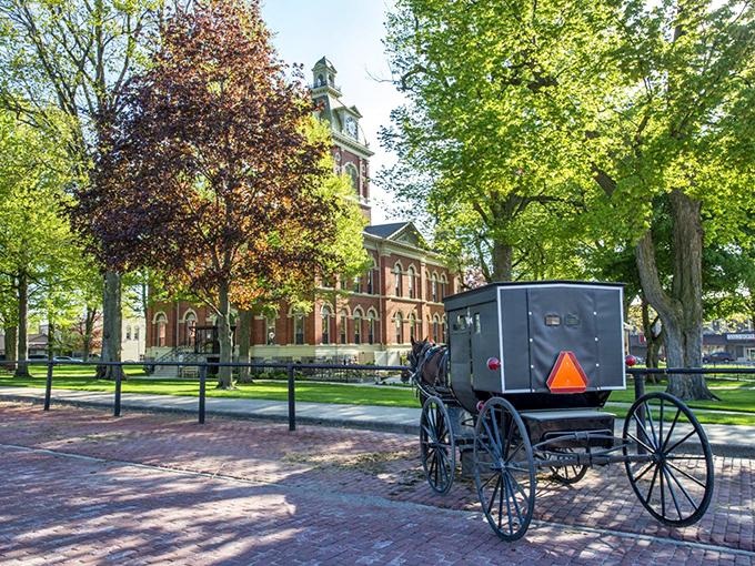 Where time slows down: A classic Amish buggy passes the historic LaGrange County Courthouse, reminding visitors that some traditions are worth preserving.