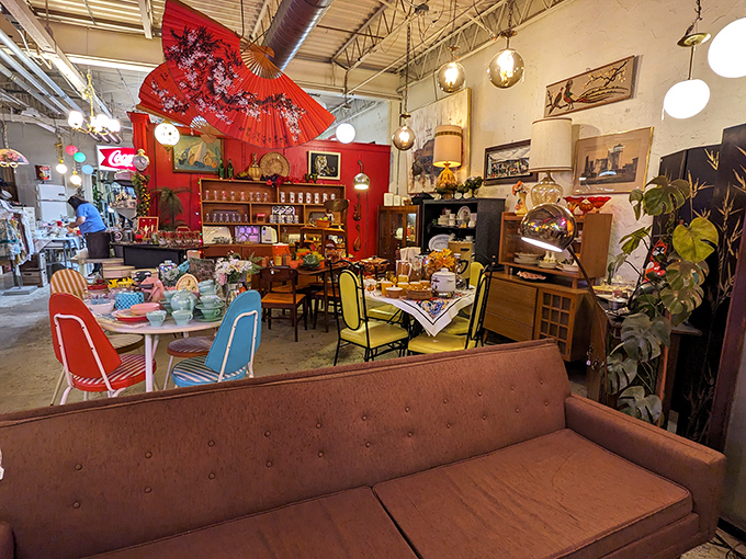 Step into this time-traveling treasure trove where vintage kitchen appliances mingle with mid-century furniture under the watchful gaze of a traffic light that never turns red.