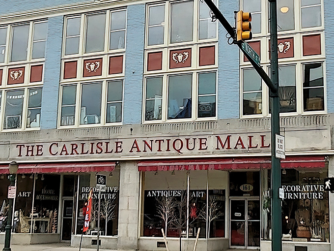 The blue fa&ccedil;ade of Carlisle Antique Mall stands like a portal to the past, inviting treasure hunters to step through its doors and back in time.