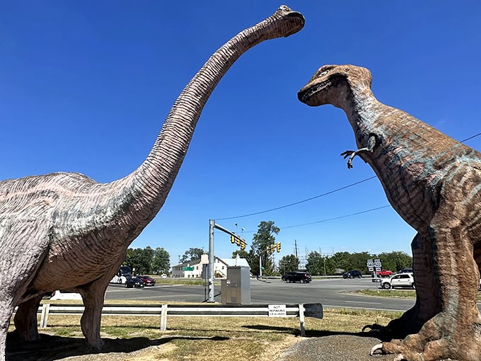 Welcome to prehistoric paradise! Two massive dinosaur sentinels guard the entrance to Dinosaur Land, where retro charm meets Jurassic-sized fun.