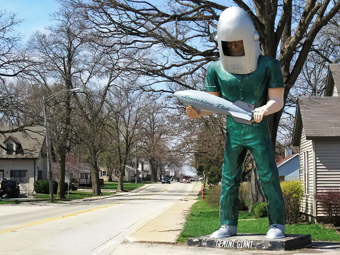 Standing tall in his residential neighborhood, the Gemini Giant proves that sometimes the best neighbors come in fiberglass.