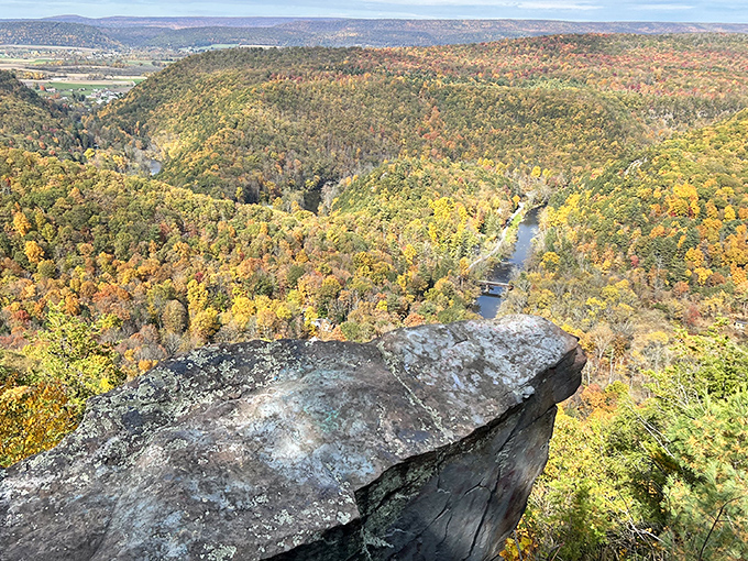 The iconic marker at Penn's View Overlook stands sentinel over an endless sea of green. Nature's own IMAX screen unfolds before you.