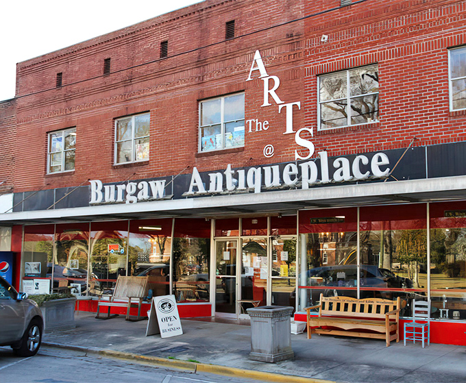 The iconic red brick façade of Burgaw Antiqueplace stands like a time capsule on the main street, beckoning treasure hunters with its vintage charm.