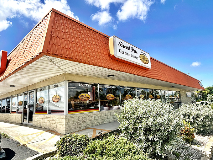 The distinctive orange roof of Bread Pete stands out like a beacon for carb-lovers, promising German baking traditions under the Florida sun.